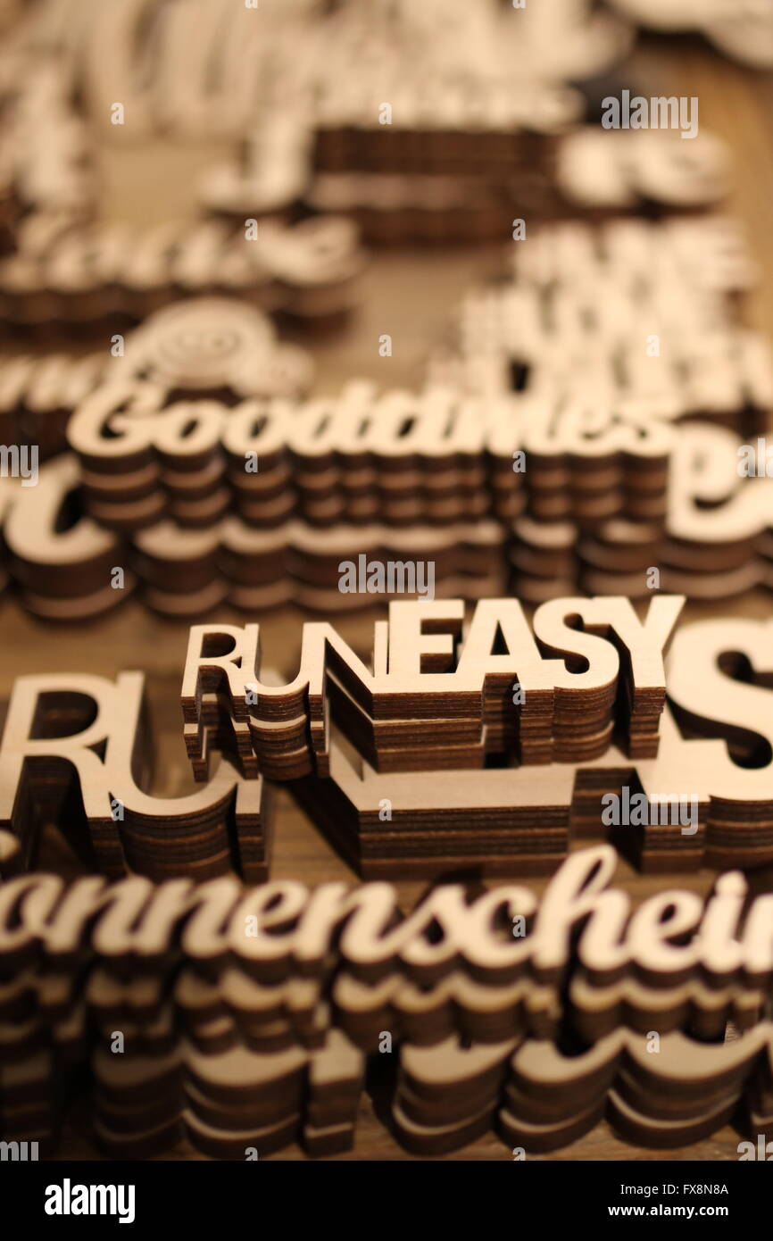 Writing carved out of wood in selective focus Stock Photo - Alamy