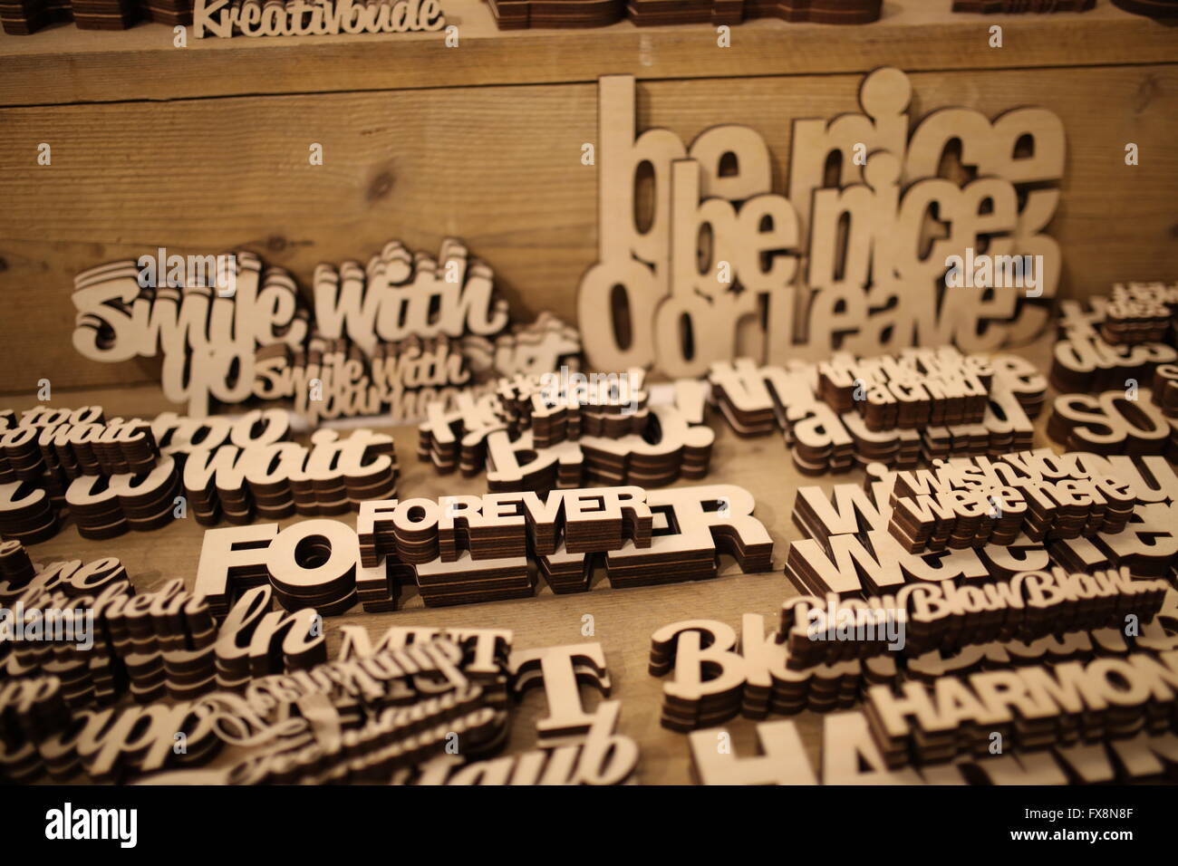 Writing carved out of wood in selective focus Stock Photo - Alamy