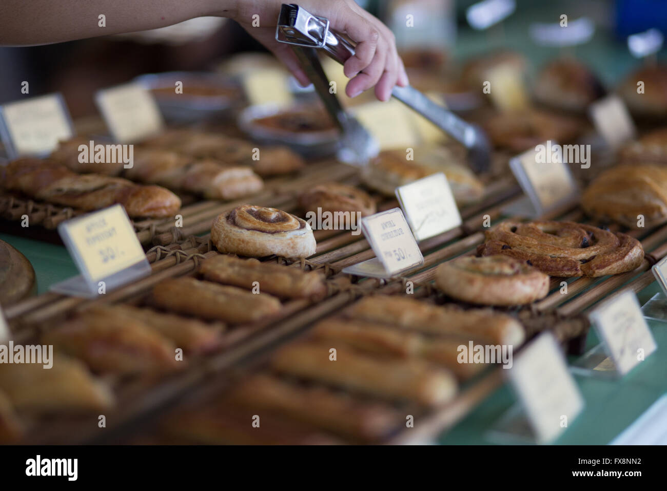Danish Pastries along with other pastries form a counter display at a ...