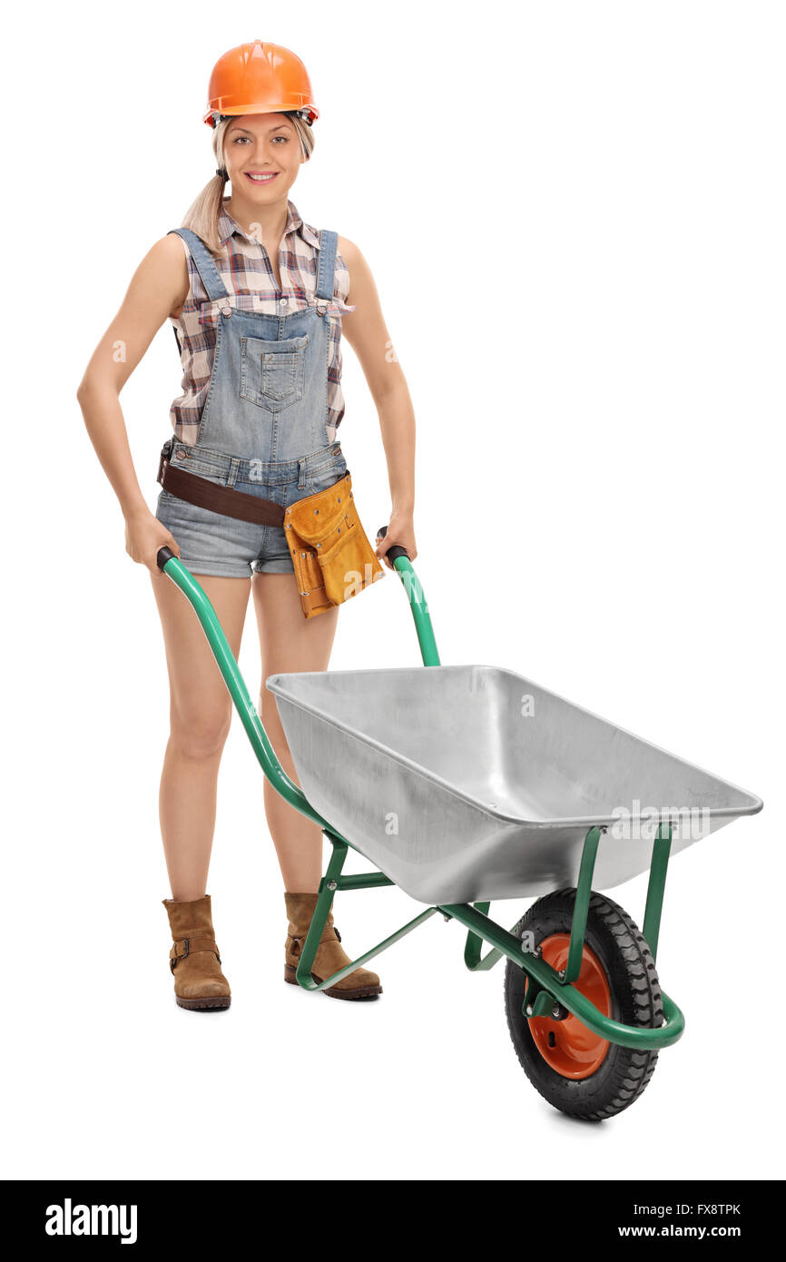 Construction Worker Pushing A Wheelbarrow High Resolution Stock ...