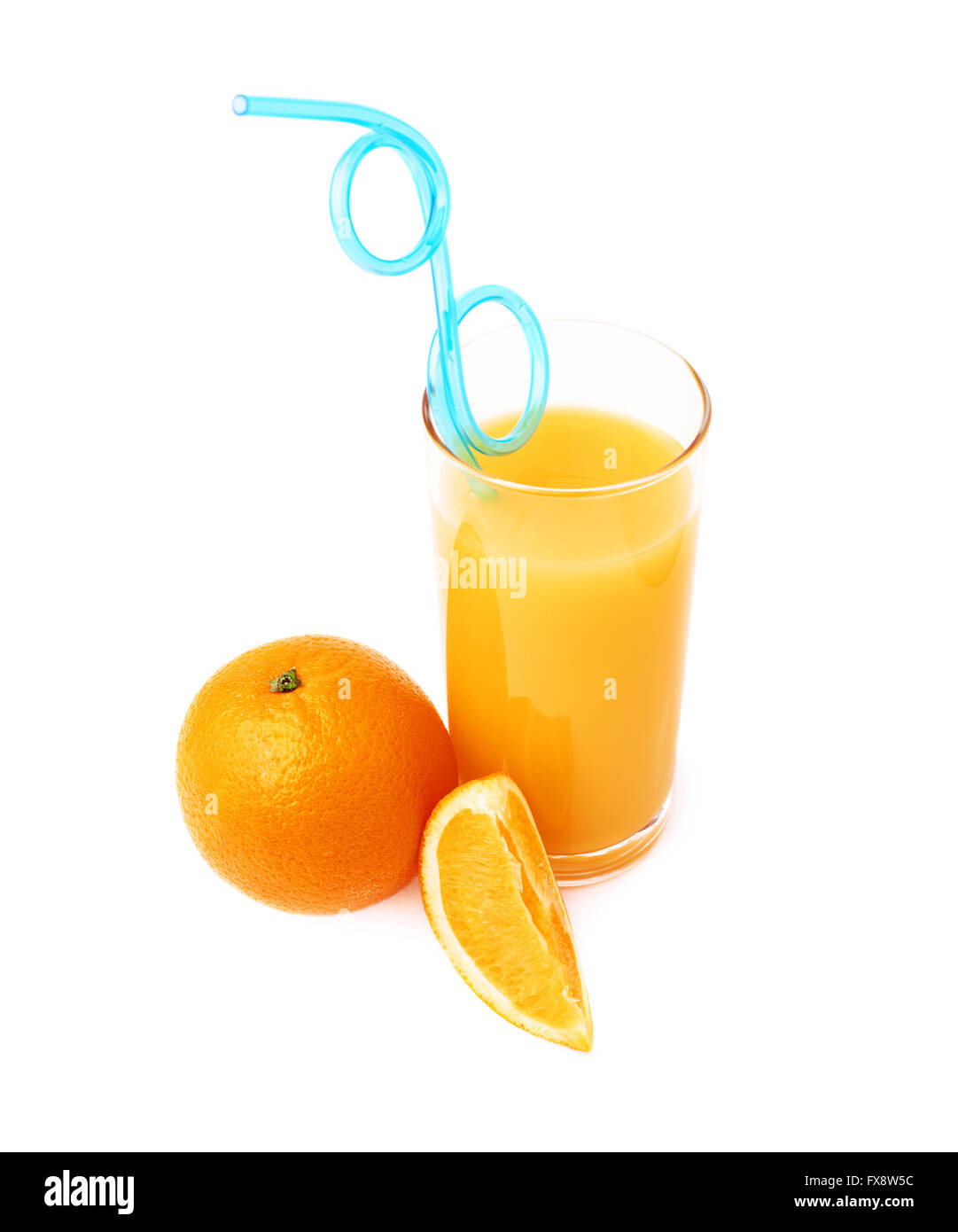 Tall glass filled with the orange juice with curved blue plastic ...