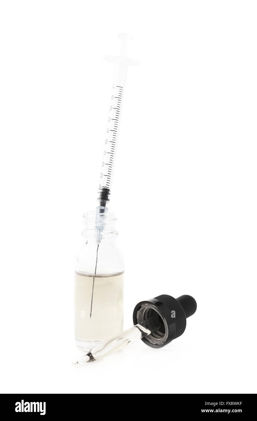 Small bottle with a pipette and syringe Stock Photo - Alamy