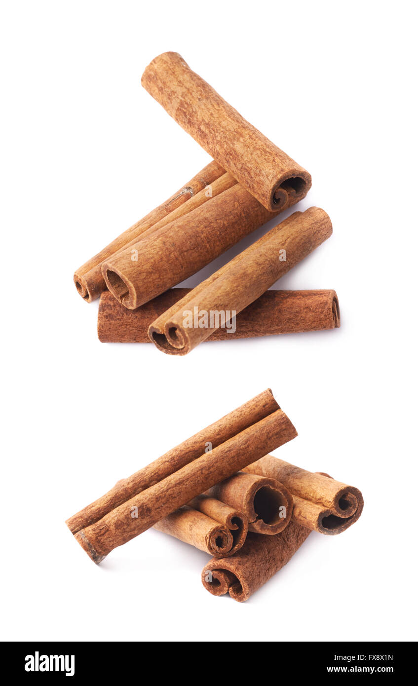 Pile of cinnamon sticks isolated Stock Photo - Alamy