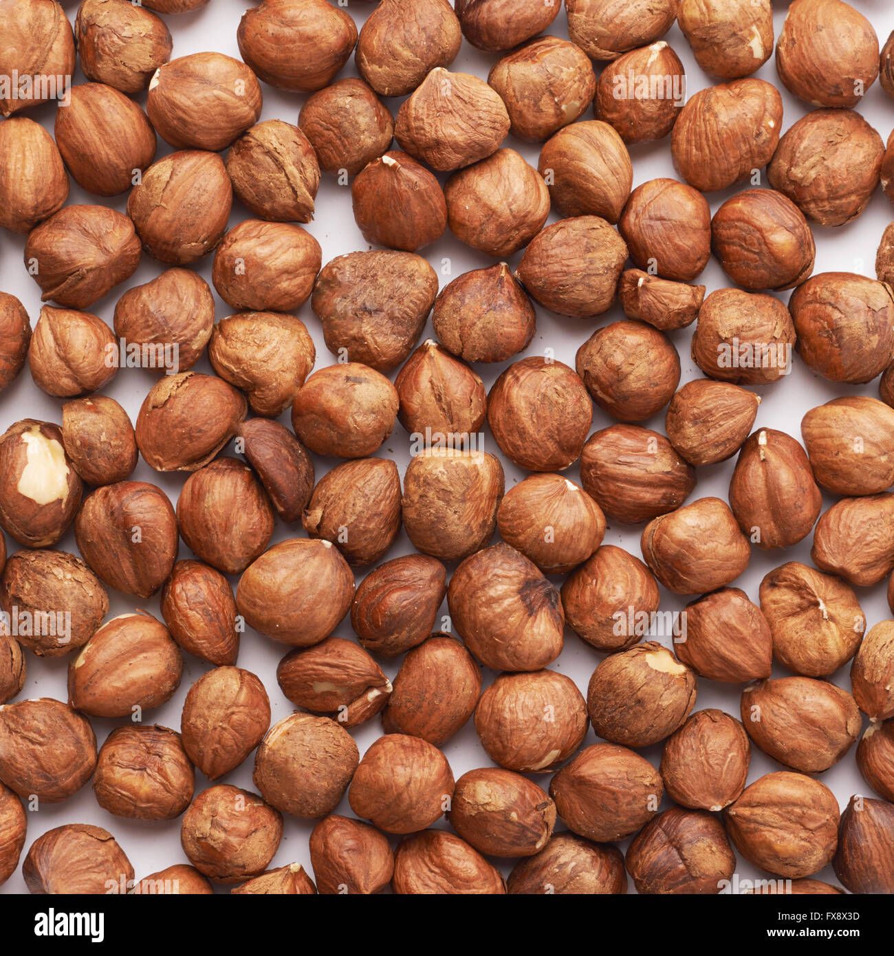 Surface covered with multiple hazelnuts Stock Photo - Alamy