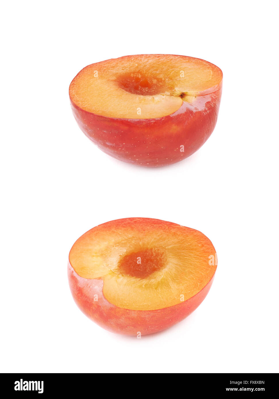 Cut open plum half isolated Cut Out Stock Images & Pictures - Alamy