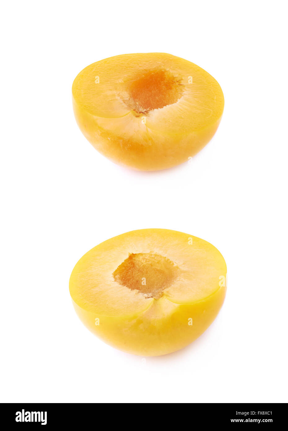 Cut open plum half isolated Stock Photo - Alamy