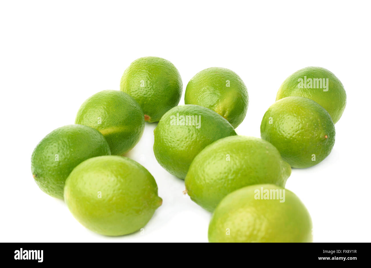 Surface covered with multiple ripe limes, composition isolated over the ...