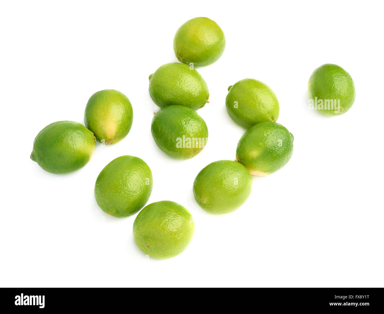 Surface covered with multiple ripe limes, composition isolated over the ...