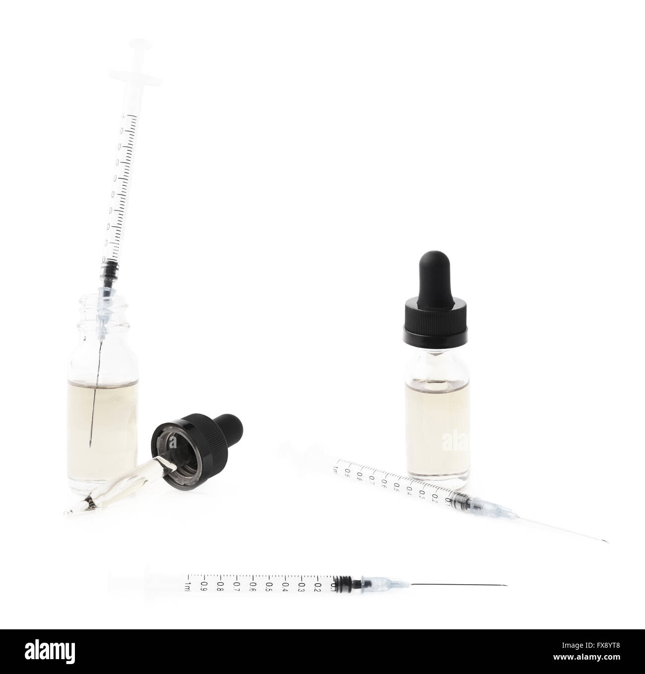 Small bottle with a pipette and syringe Stock Photo - Alamy