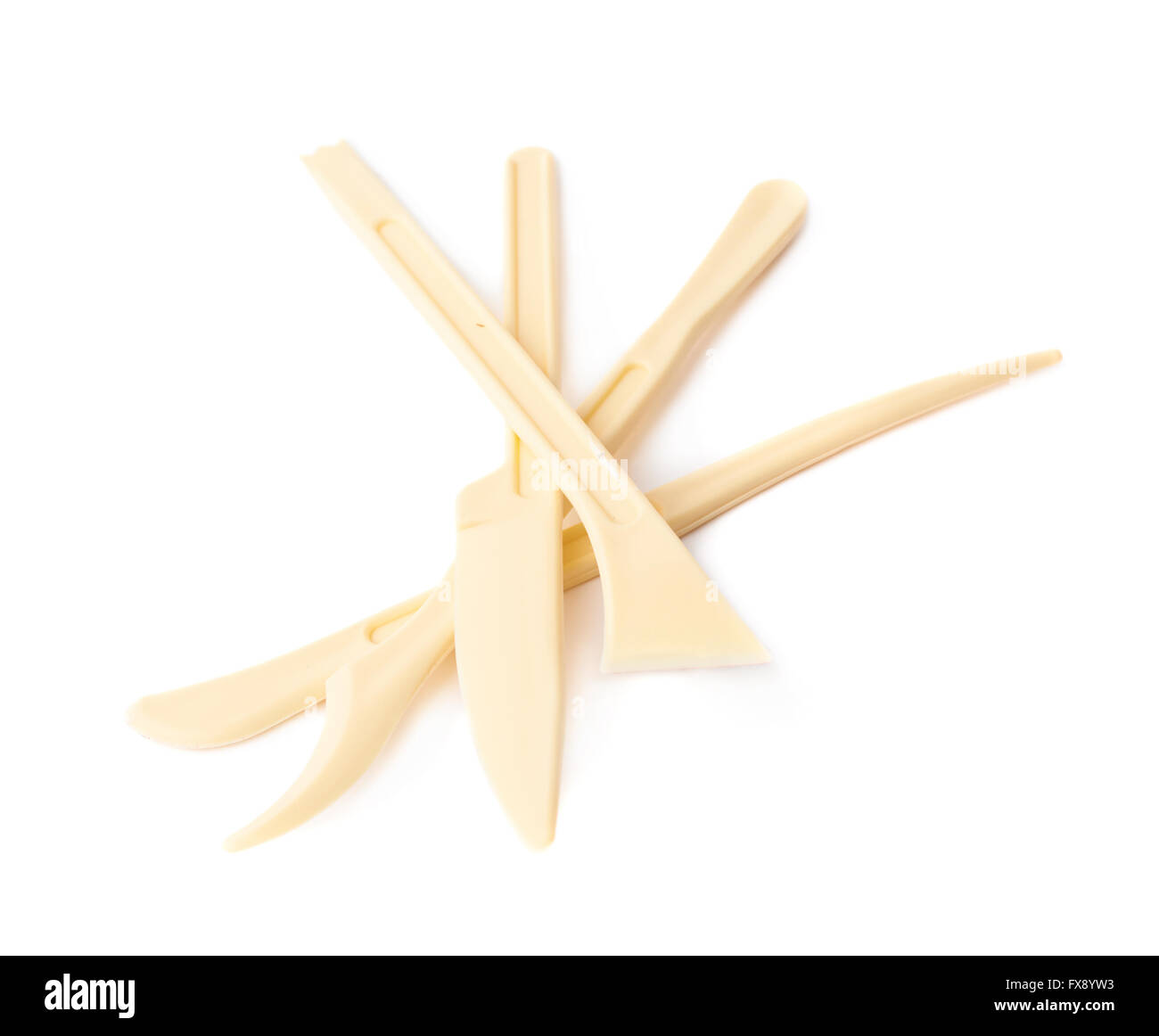 Pile of plastic knife tools isolated Stock Photo - Alamy
