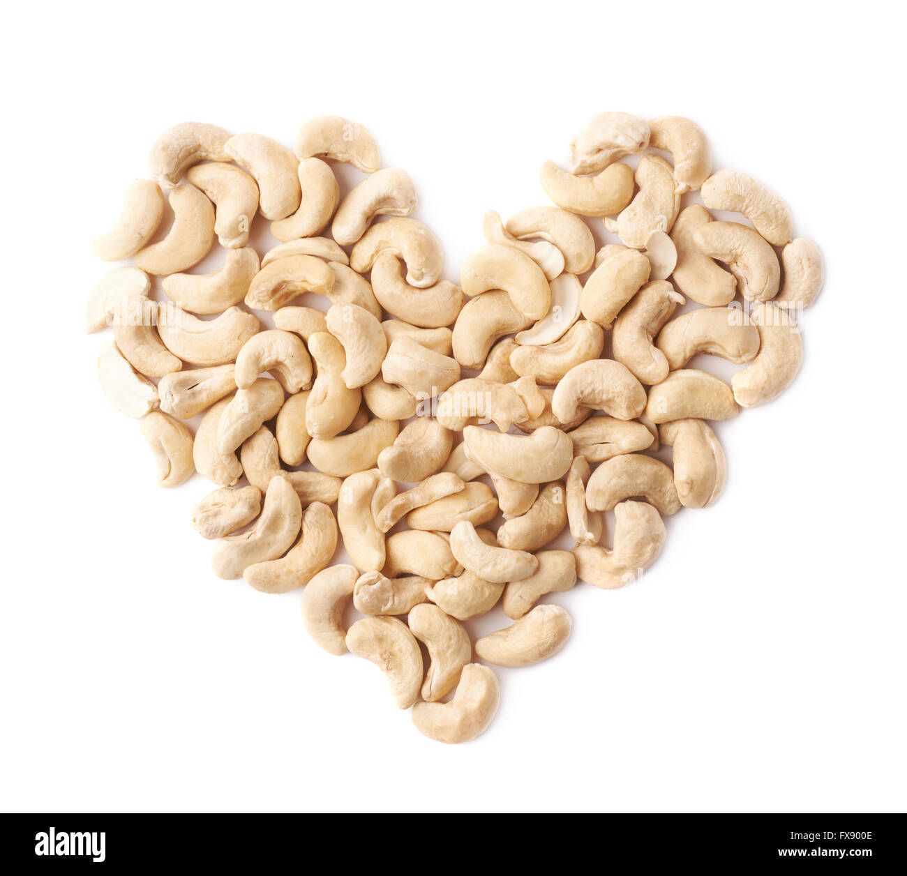 Heart shape made of cashew nuts isolated Stock Photo - Alamy