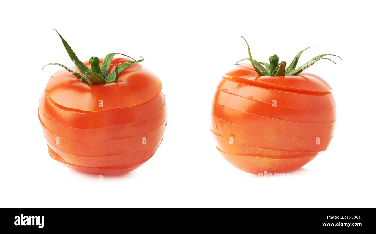 Tomato cut in slices isolated Stock Photo - Alamy