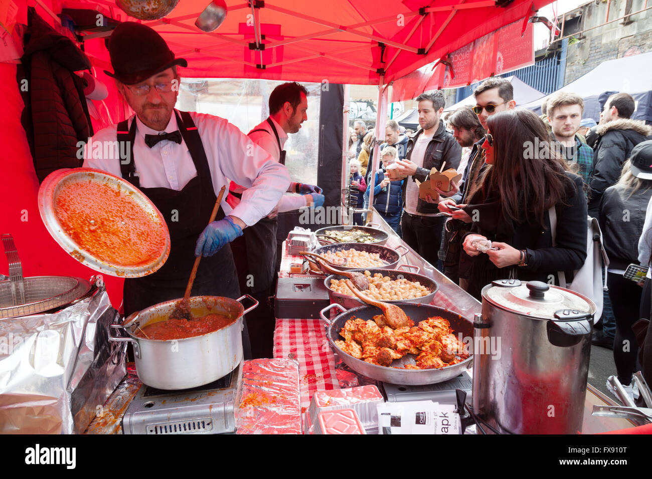 People buying food at a market stall, Brick Lane Sunday Upmarket ...