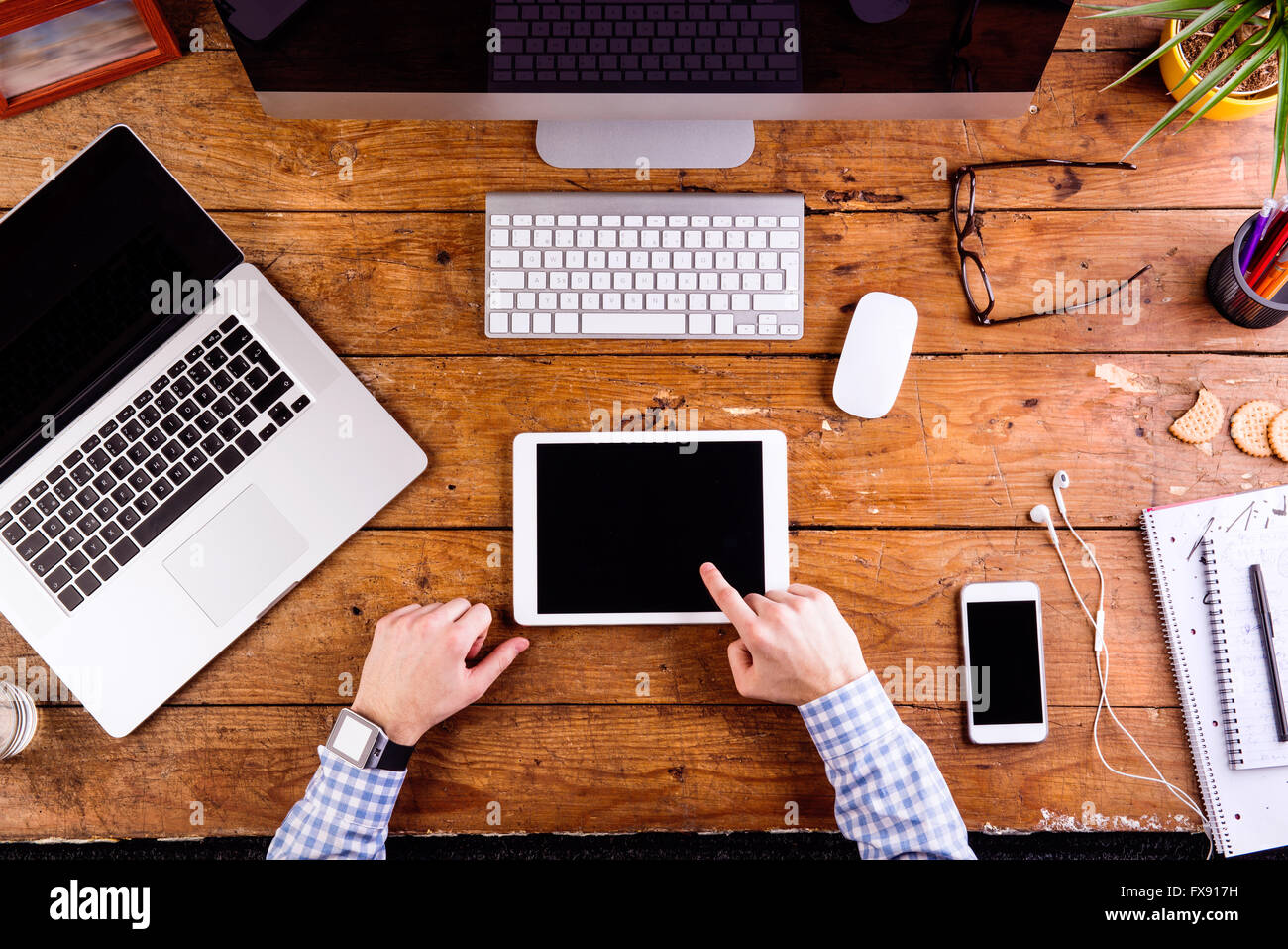 Business person working at office desk wearing smart watch Stock Photo ...