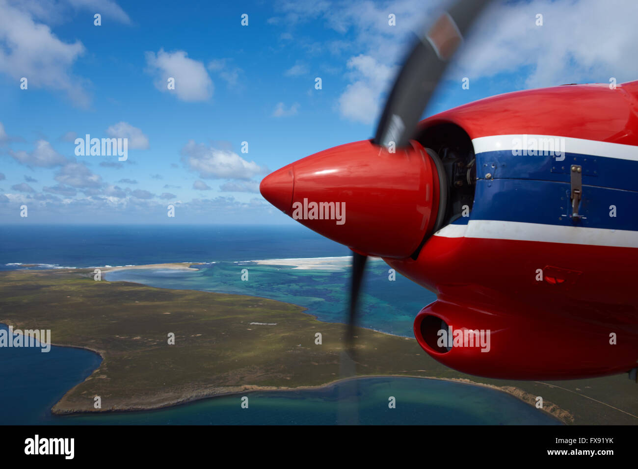 Aircraft flying over beautiful white sandy beaches and clear blue ...