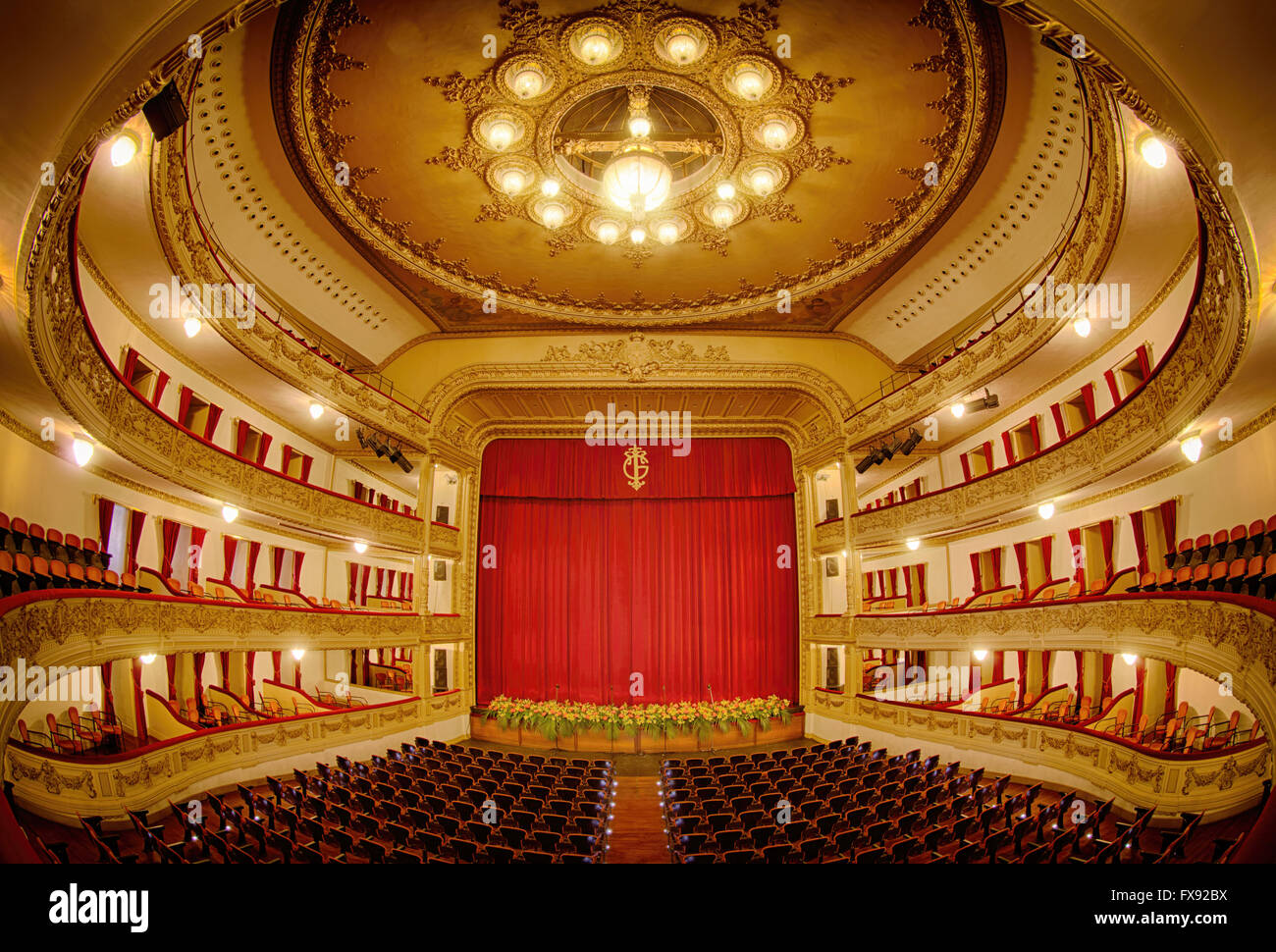wide angle view of Guimera theatre stage with lowered curtain, stalls ...