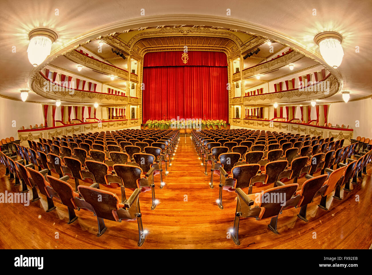 wide angle view of Guimera theatre stage with lowered curtain, stalls ...