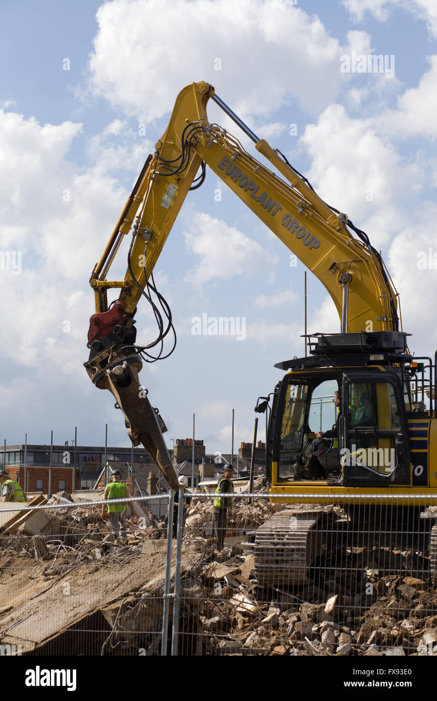 House demolition with a heavy moving excavator Stock Photo - Alamy