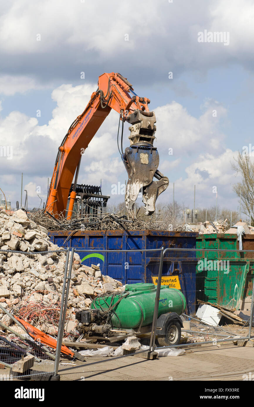 House demolition with a heavy moving excavator Stock Photo - Alamy