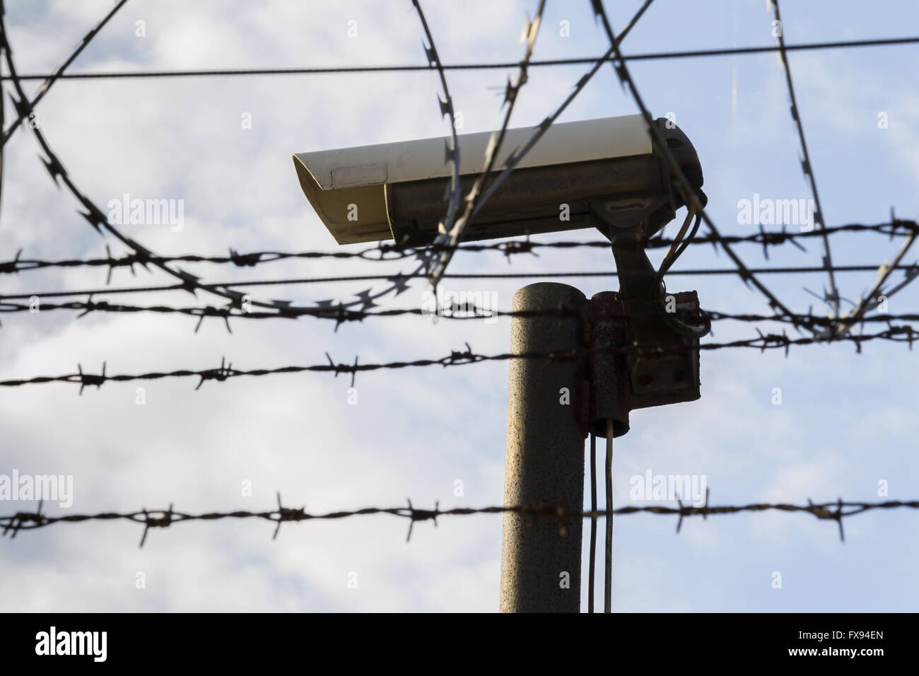 Razor wire fence cctv camera hi-res stock photography and images - Alamy