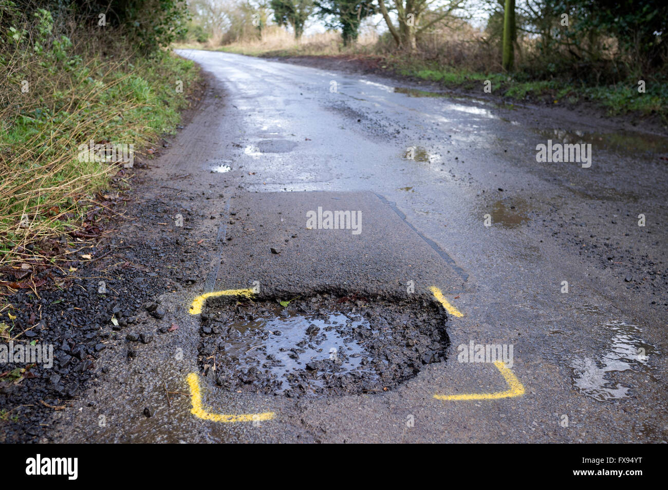 Pothole on tarmac road hi-res stock photography and images - Alamy