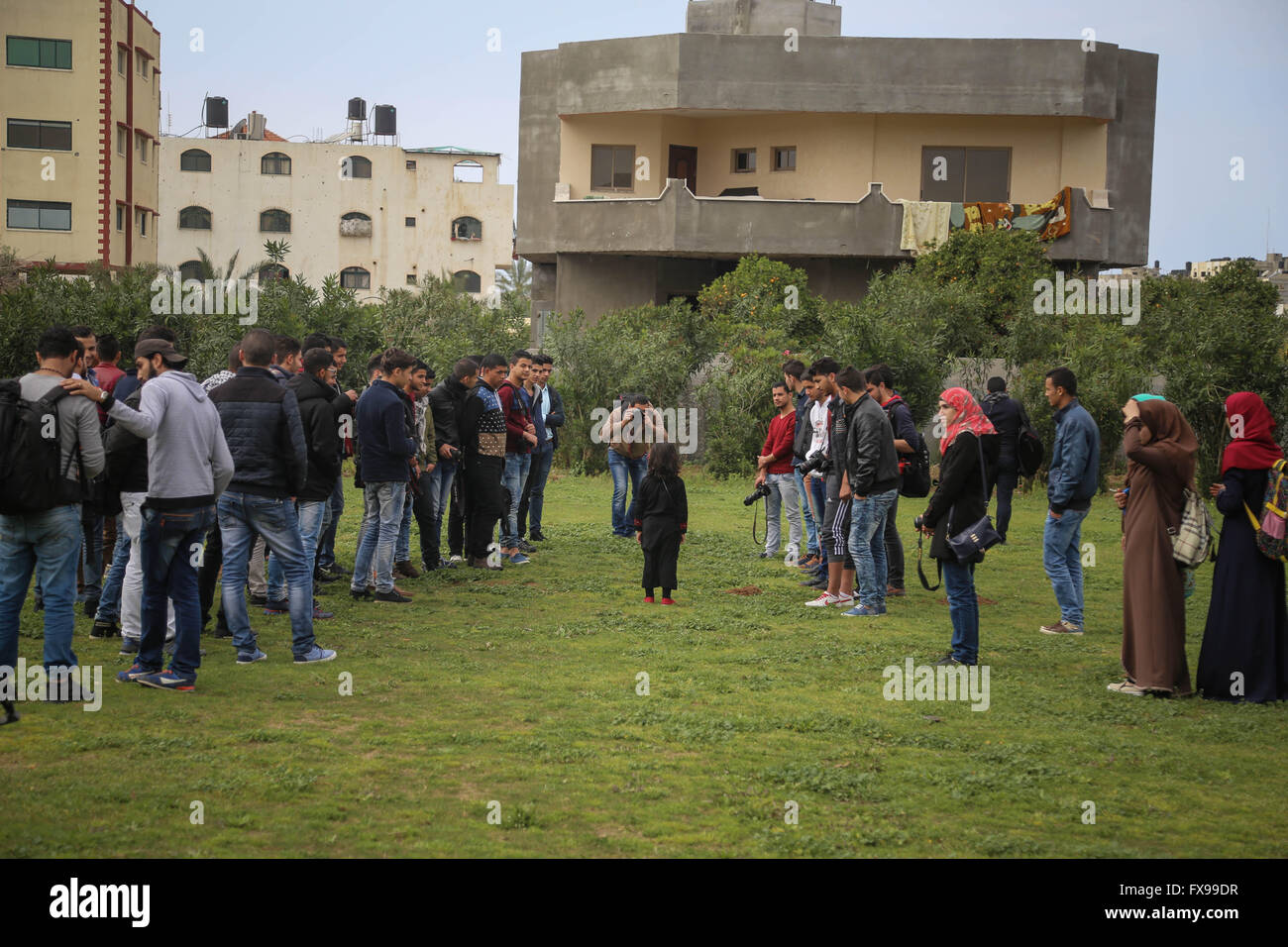 Palestinian photographers during a training session in photography with ...