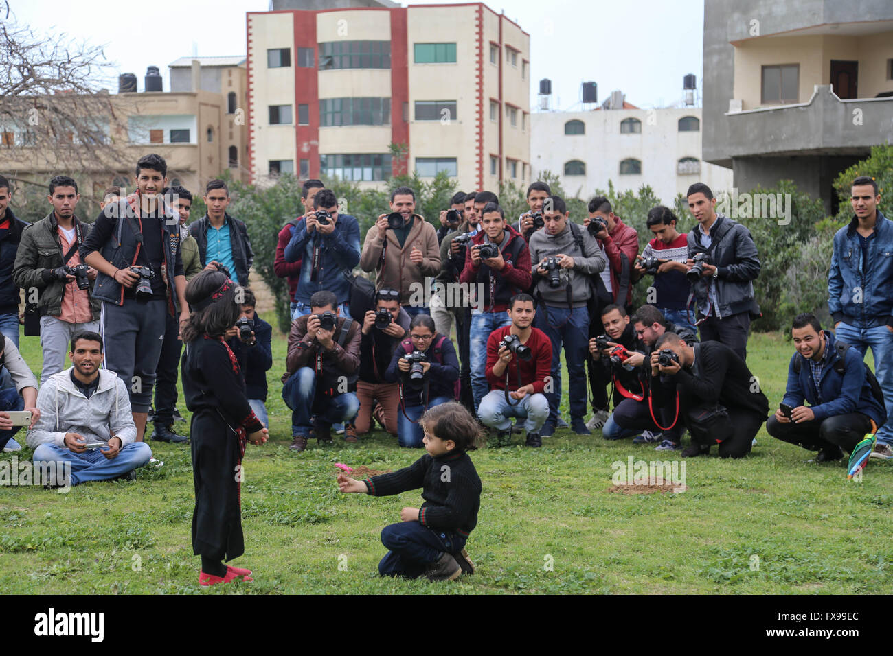 Palestinian photographers during a training session in photography with ...