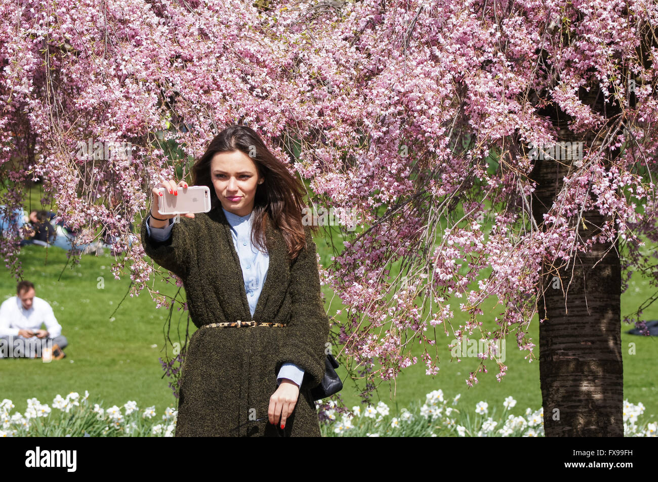 People enjoying spring weather in St James's Park, London England ...