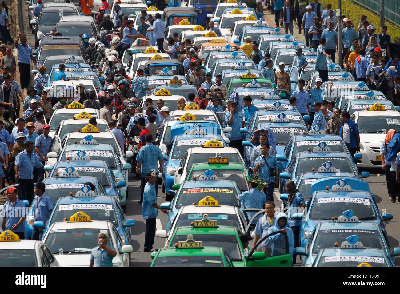 Jakarta, Indonesia. 22nd Mar, 2016. Taxi drivers block the main road ...