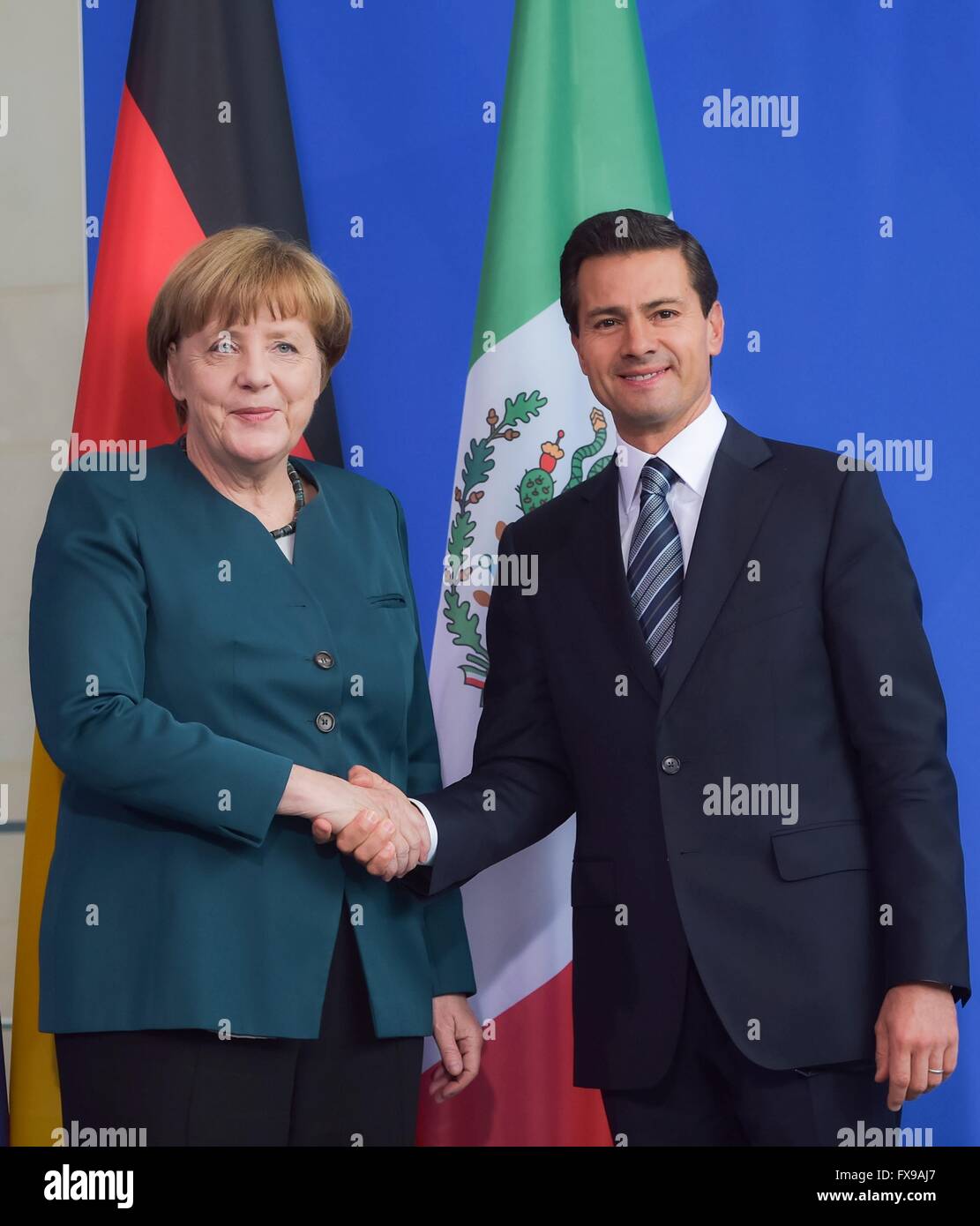 German Chancellor Angela Merkel shakes hands with Mexican President ...