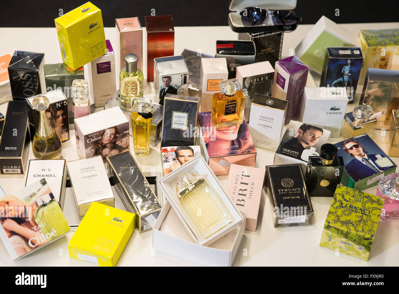 Hamburg, Germany. 13th Apr, 2016. Counterfeit perfume bottles and ...