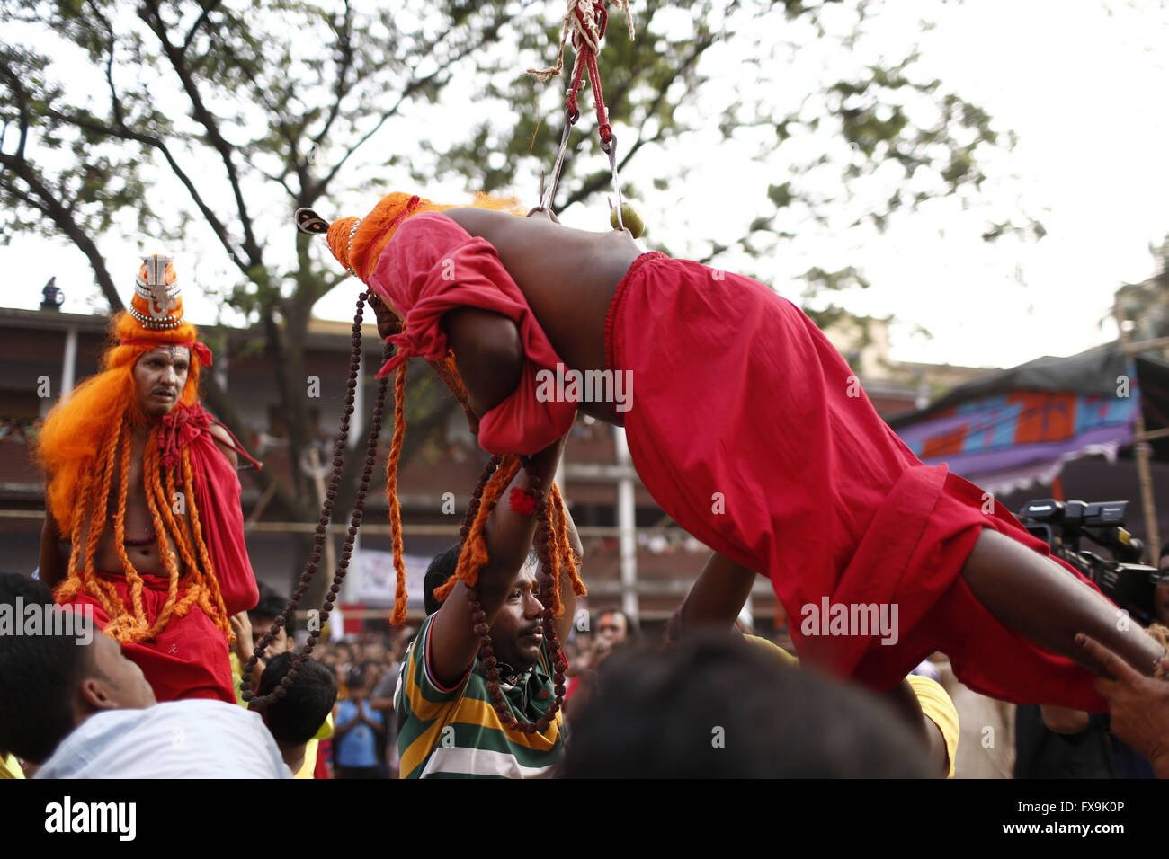 Dhaka, Bangladesh. 13th Apr, 2016. A Bangladeshi Hindu devotee hangs in ...
