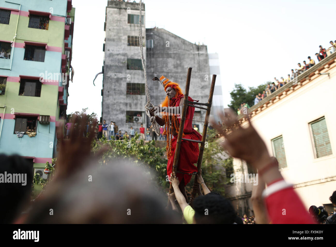 Dhaka, Bangladesh. 13th Apr, 2016. A Bangladeshi Hindu devotee prepares ...