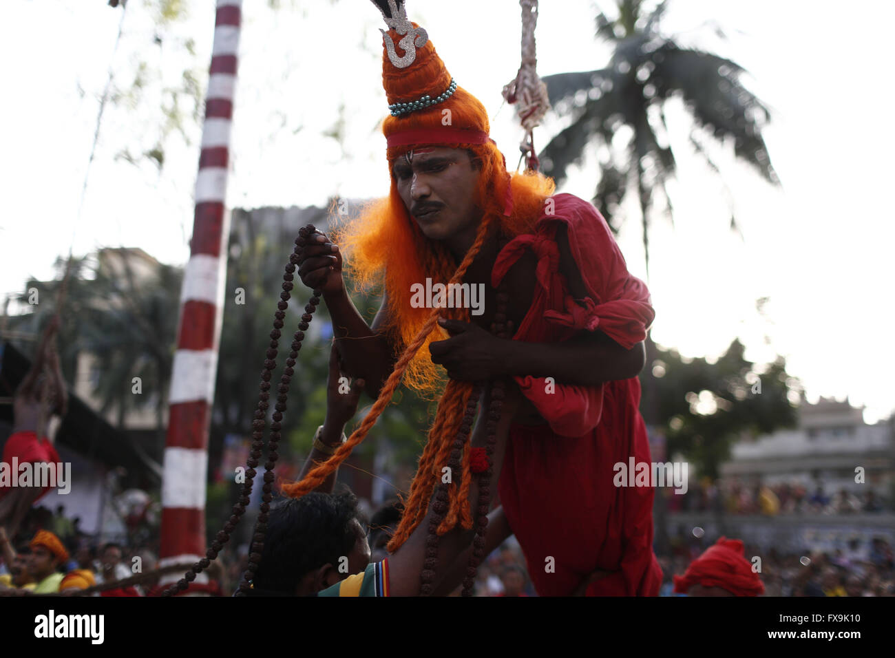 Dhaka, Bangladesh. 13th Apr, 2016. A Bangladeshi Hindu devotee hangs in ...