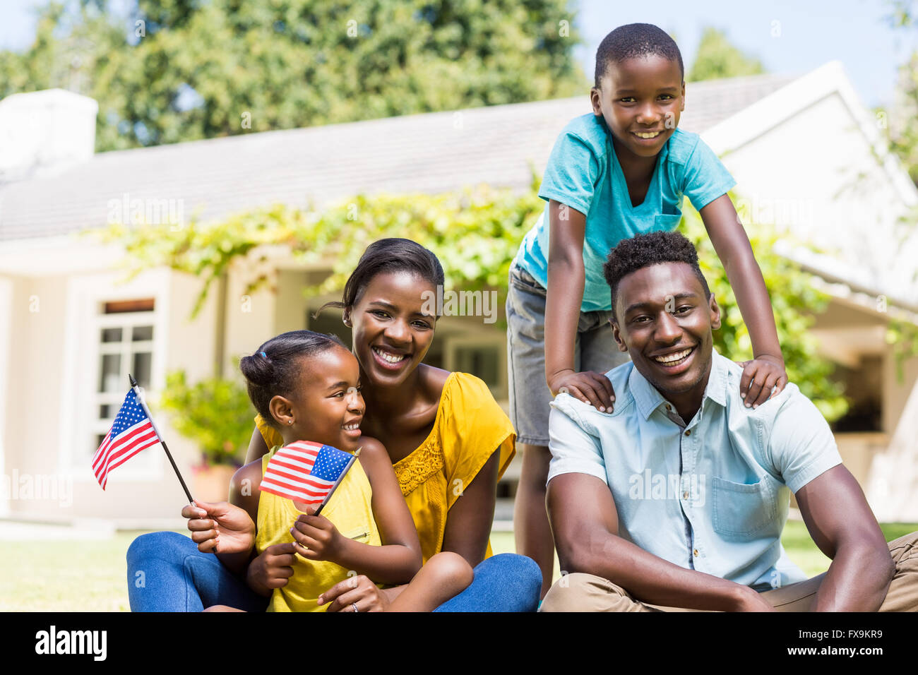 Happy family showing usa flag Stock Photo - Alamy