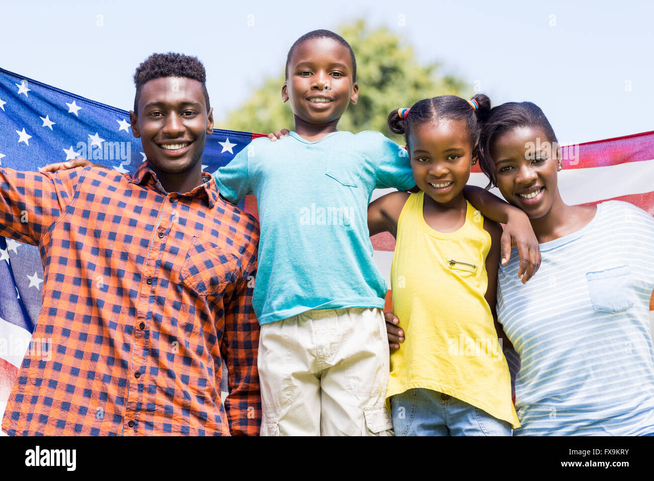 Happy family showing usa flag Stock Photo - Alamy