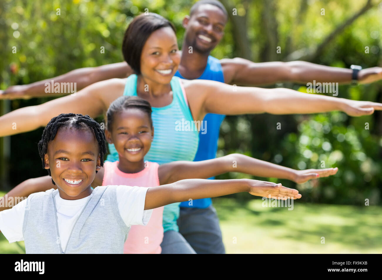 Happy family relaxing together Stock Photo - Alamy