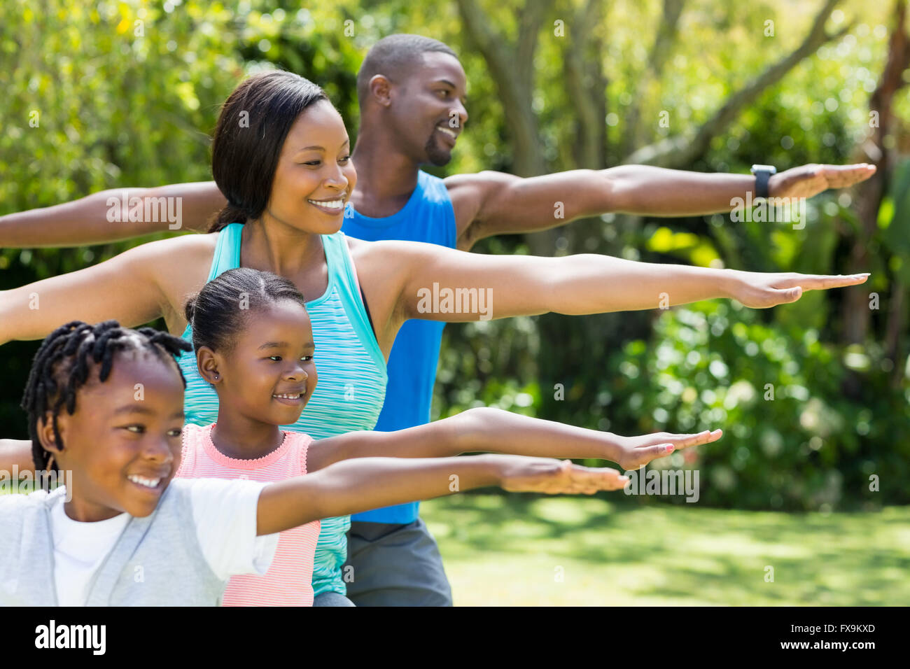 Happy family relaxing together Stock Photo - Alamy