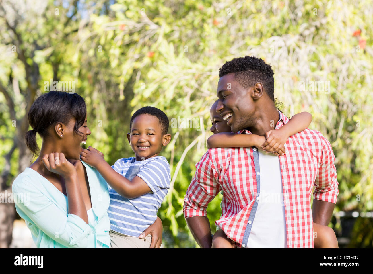 Happy family posing together Stock Photo - Alamy