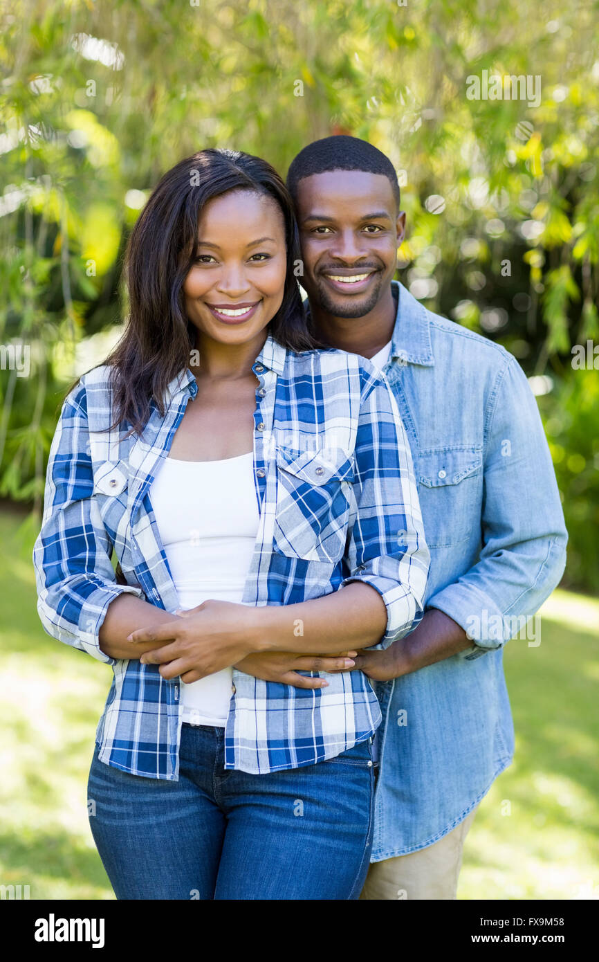 Happy couple posing together Stock Photo - Alamy