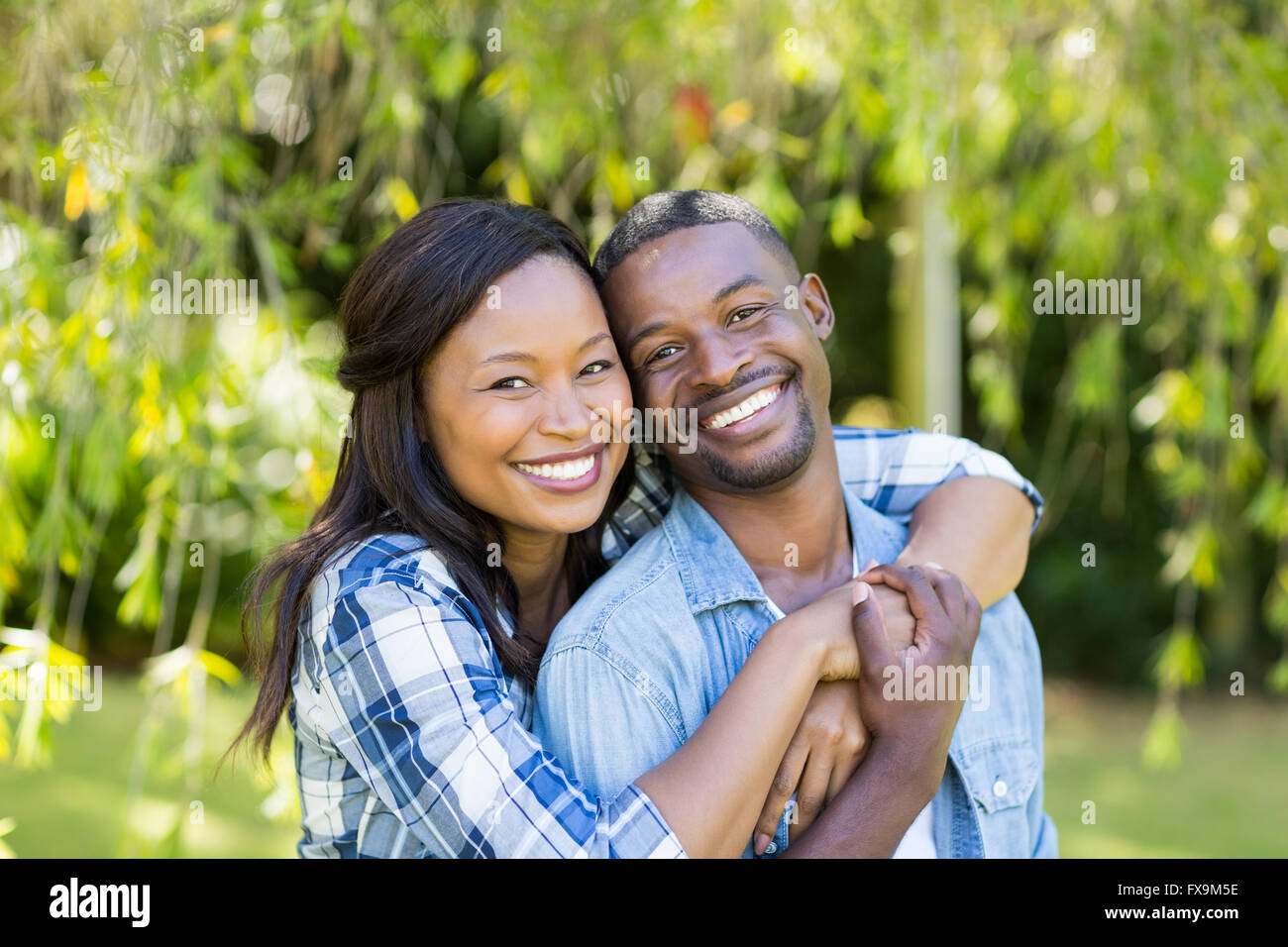 Happy couple posing together Stock Photo - Alamy