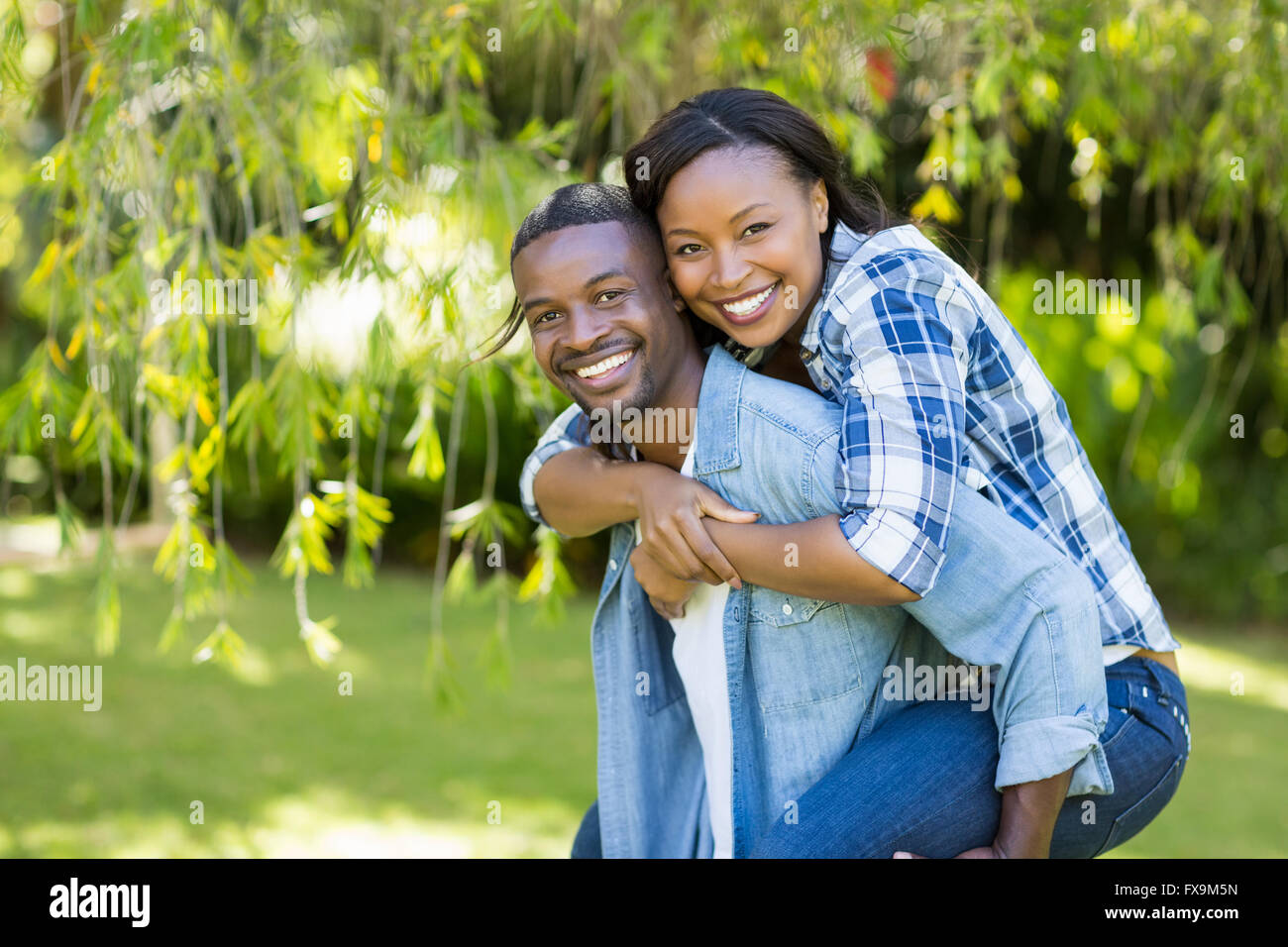 Happy couple posing together Stock Photo - Alamy