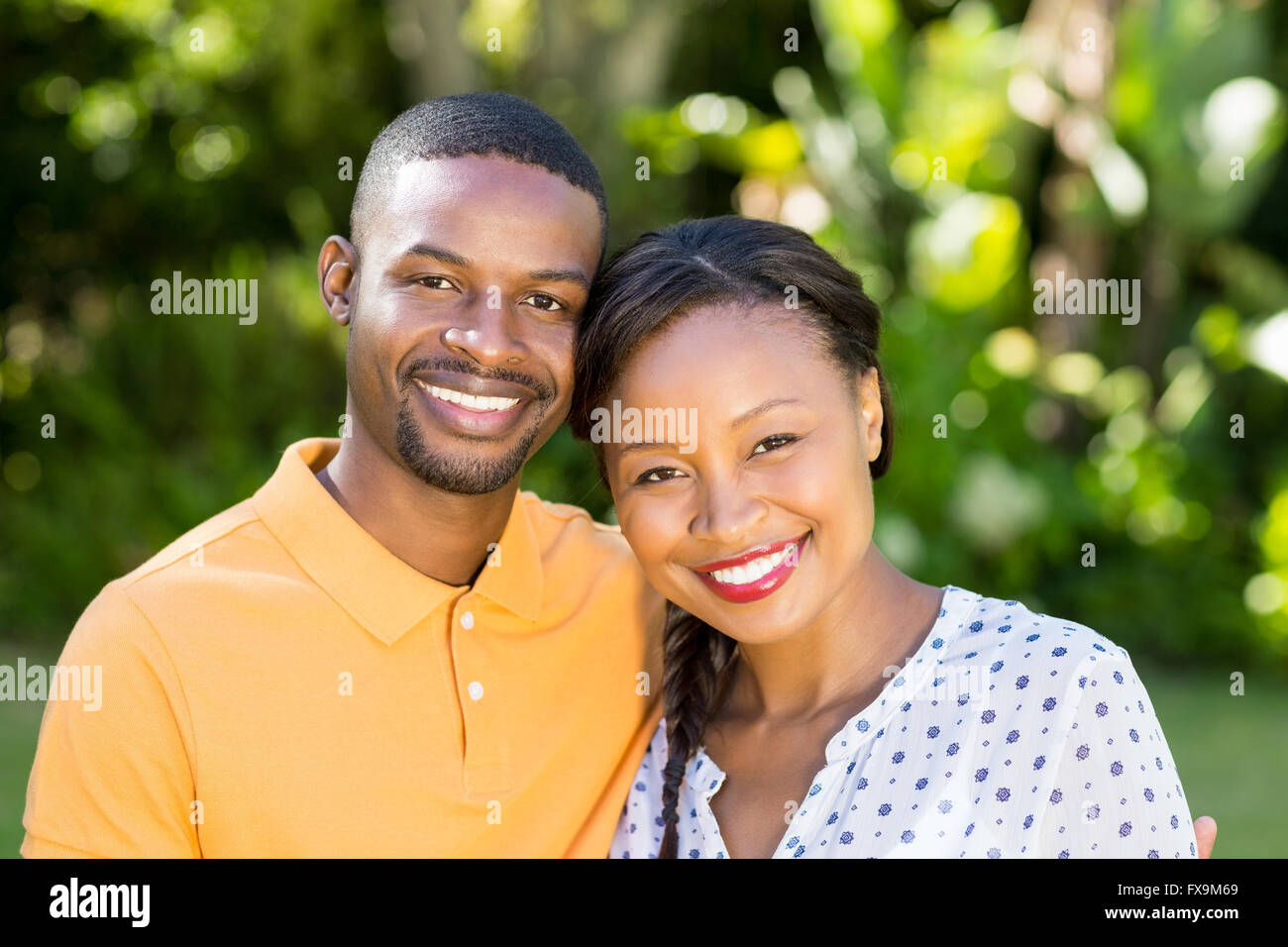 Happy couple posing together Stock Photo - Alamy