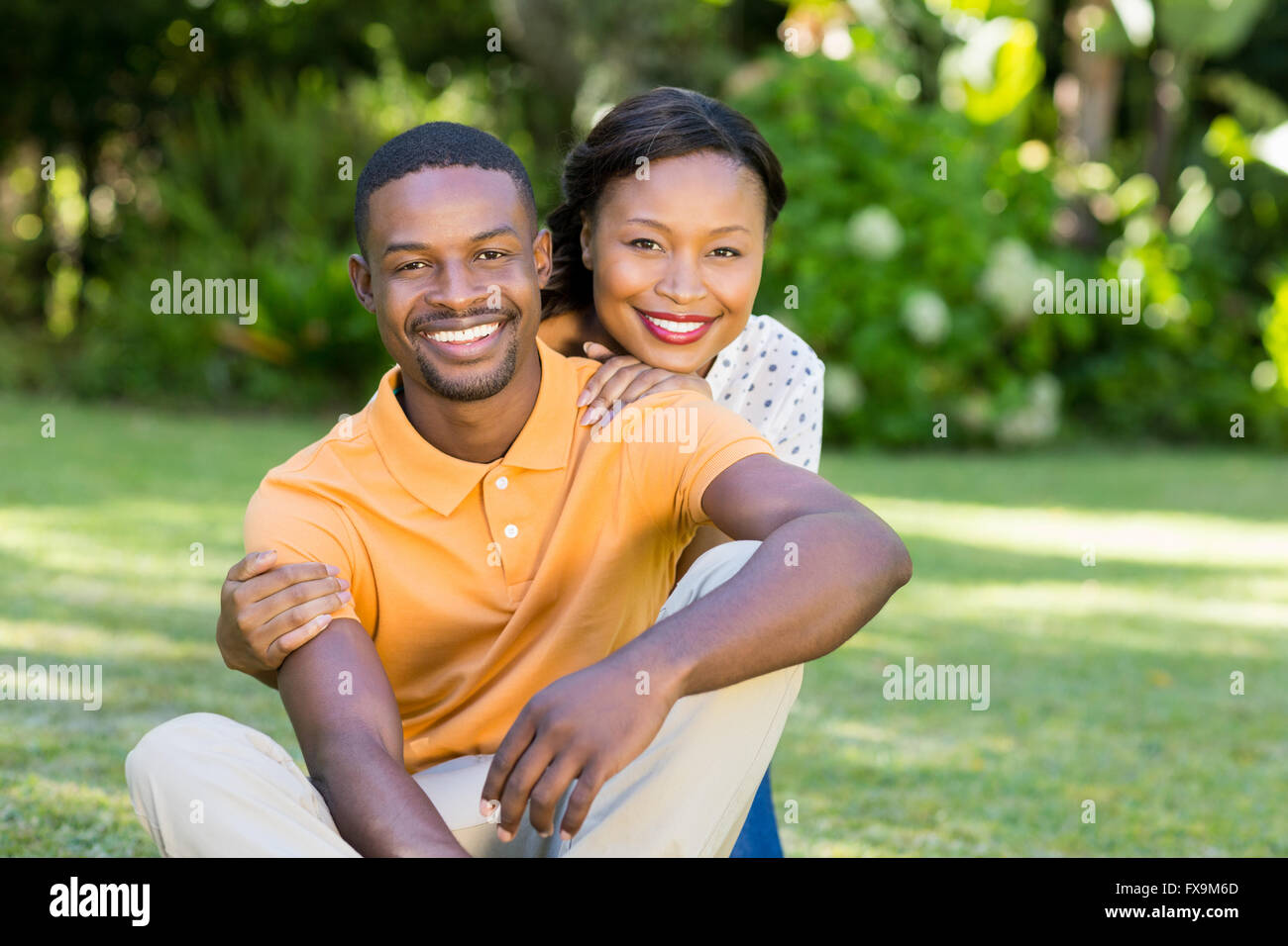 Happy couple posing together Stock Photo - Alamy