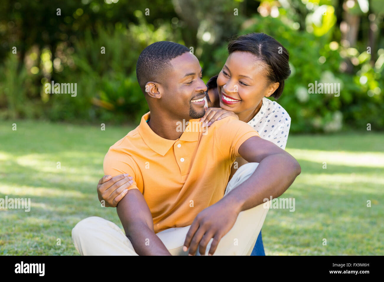 Happy couple posing together Stock Photo - Alamy