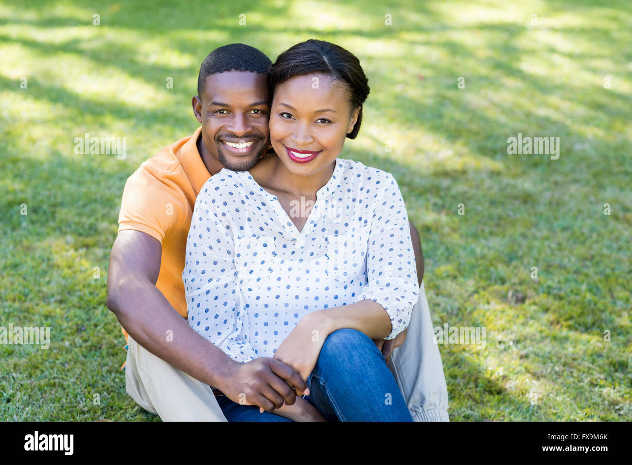 Happy couple posing together Stock Photo - Alamy