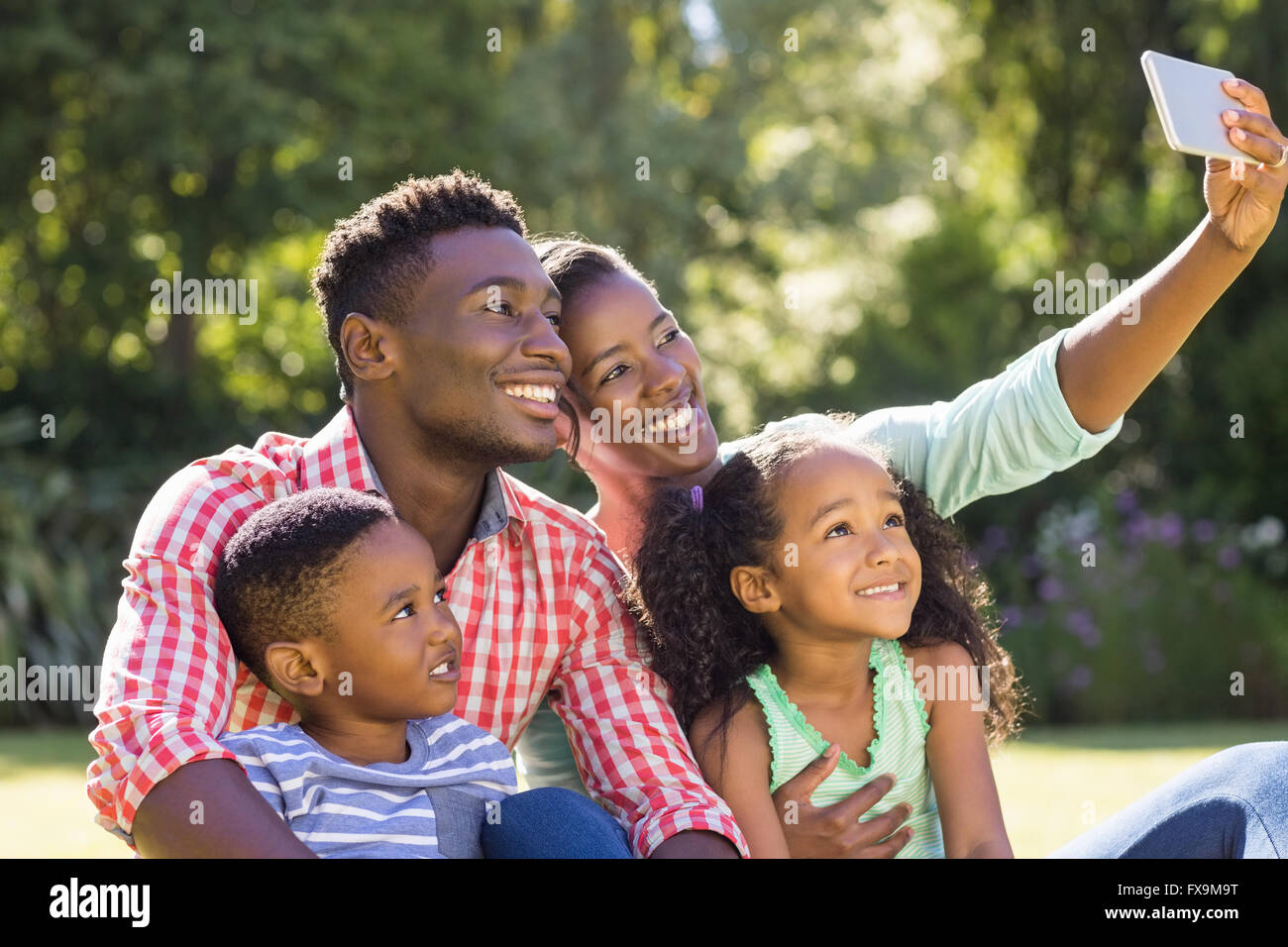 Happy family taking picture Stock Photo - Alamy