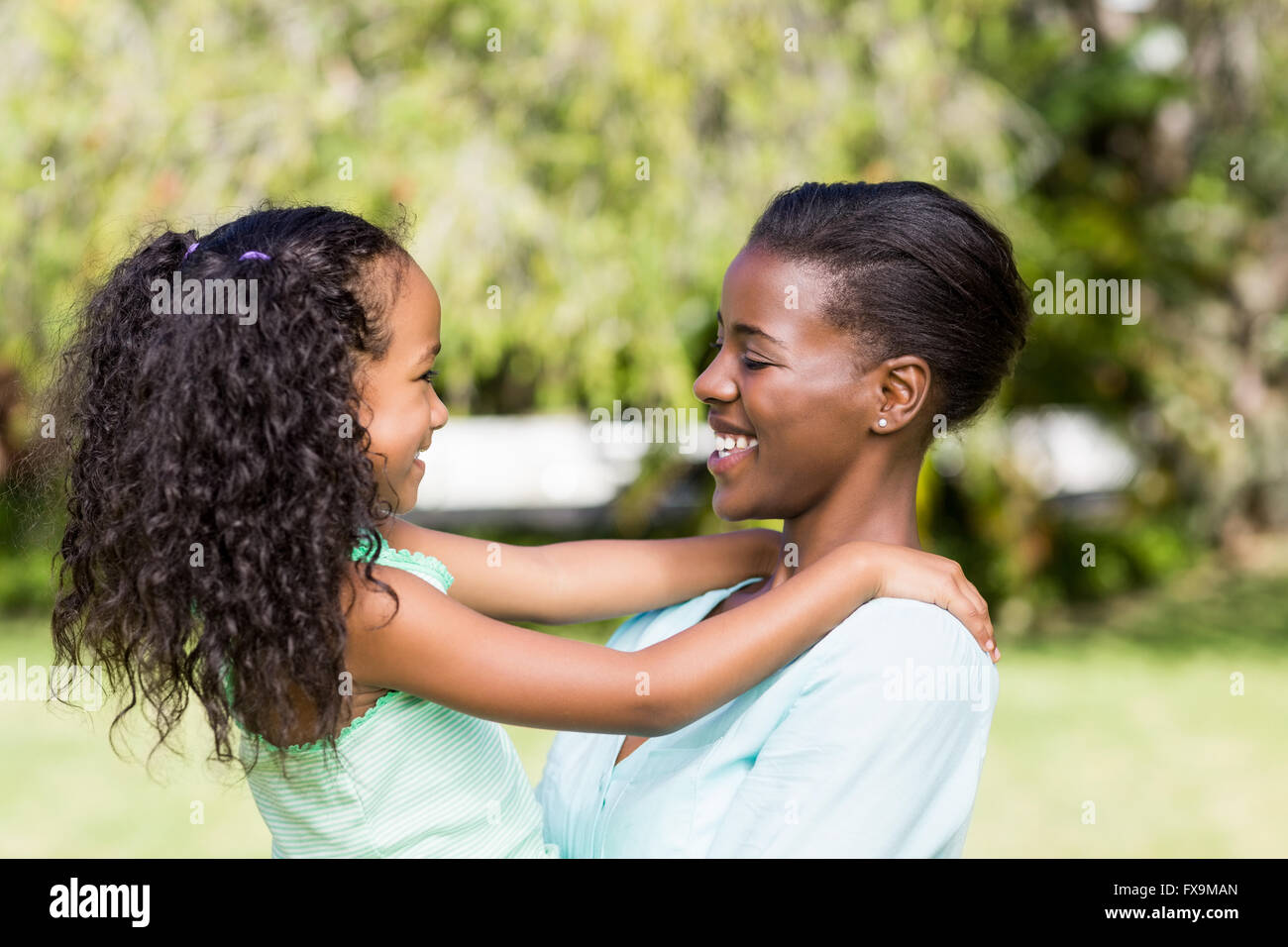 Happy family looking each other Stock Photo - Alamy