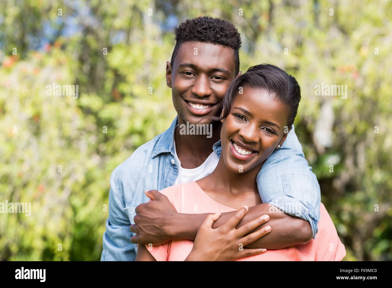 Happy couple couple posing together Stock Photo - Alamy