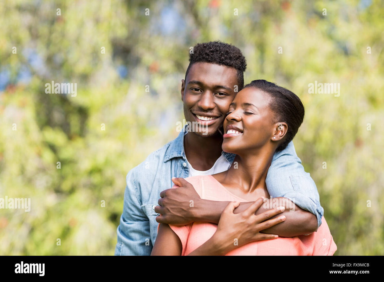 Happy couple posing together Stock Photo - Alamy